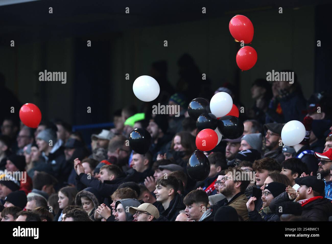 London, UK. 11th Jan, 2025. Morecambe fans with banners and balloons in ...