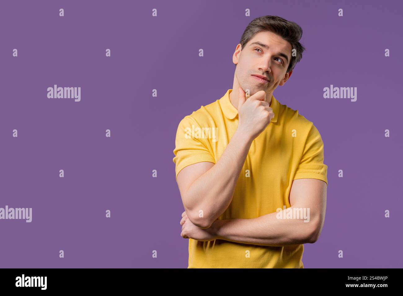 Thinking around man on violet background. Smart student guy finding ...