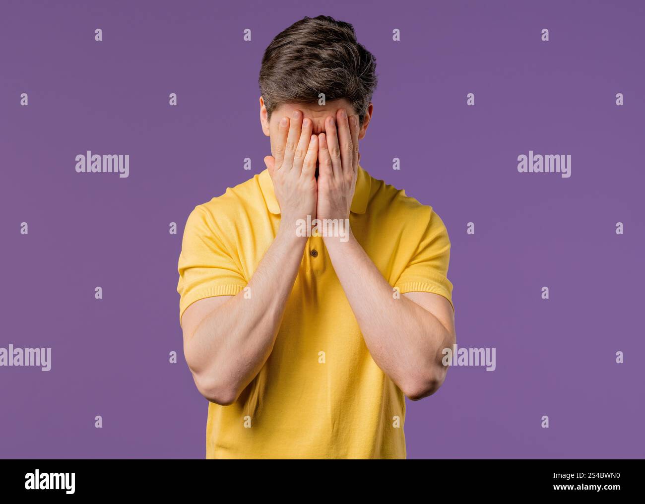 Worried man doing facepalm gesture, covering face with hands, like no ...
