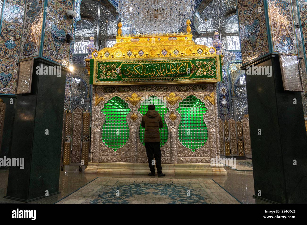 CORRECTS SPELLING OF MOHAMMAD A man carries his child as they pray at ...