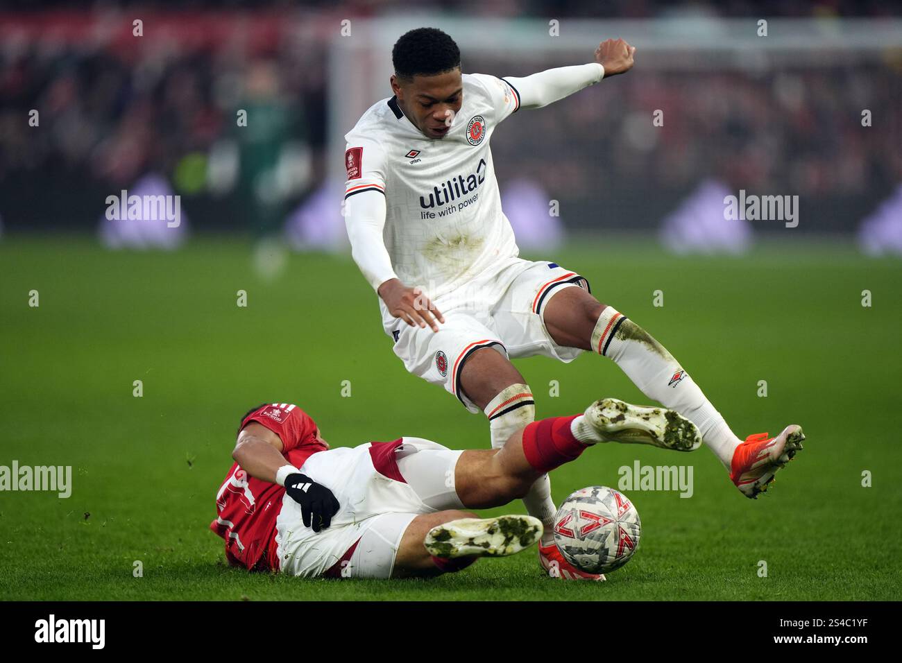 Nottingham Forest's Eric da Silva Moreira slides in on Luton Town's ...