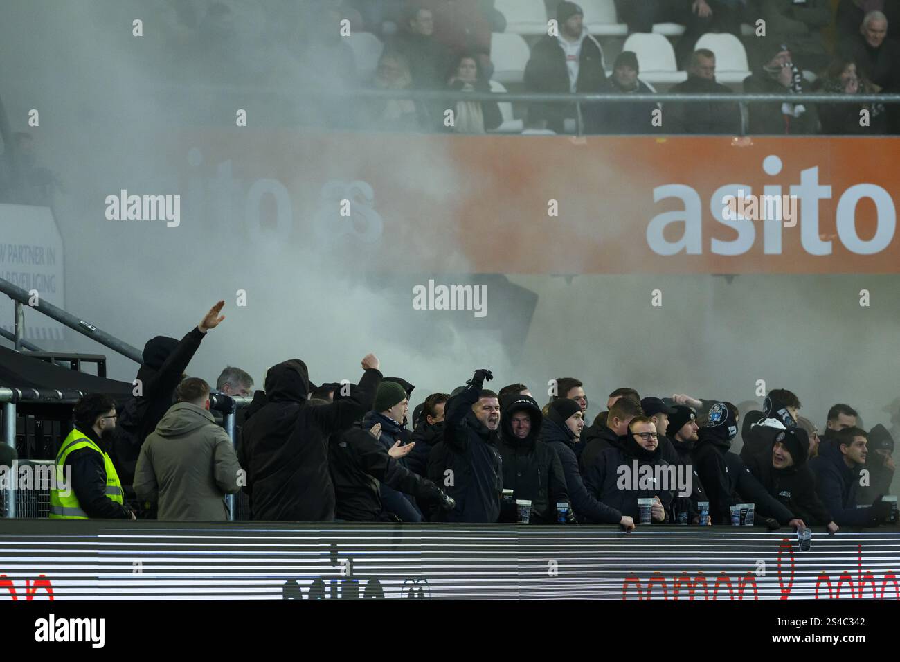 ALMELO - Angry Heracles supporters throw fireworks on the field during ...
