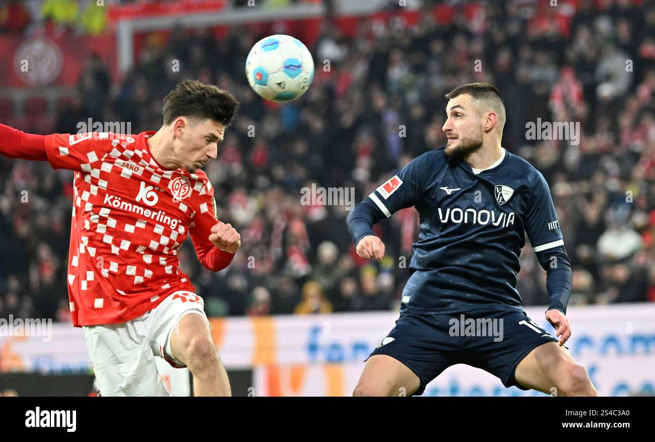 Mainz's Anthony Caci, left, vies for the ball with Bochum's Matus Bero ...