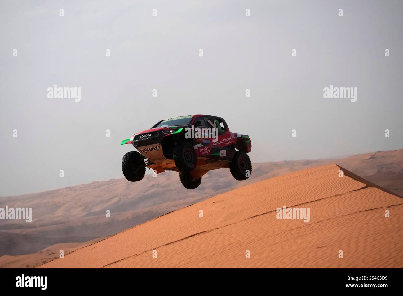 Driver Yazeed Al Rajhi and co-driver Timo Gottschalk compete during the ...