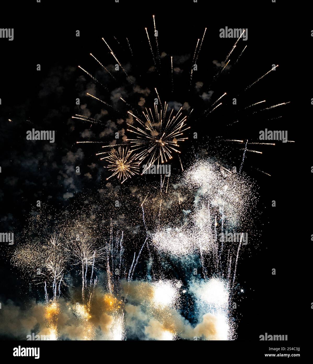 A vibrant fireworks display lights up the night sky, showcasing bursts ...