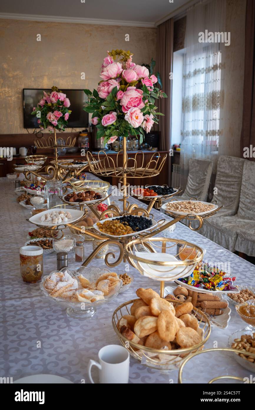 Almaty, Kazakhstan. 25th Dec, 2024. Dishes of Kazakh nuts and bread are ...