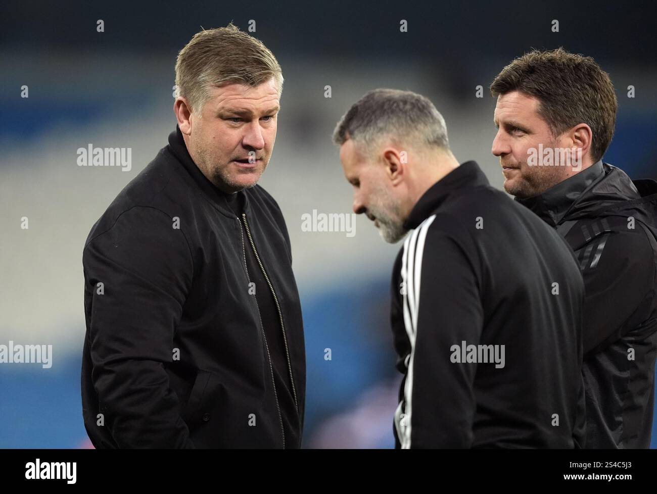 Salford City manager Karl Robinson with assistants Ryan Giggs (centre ...