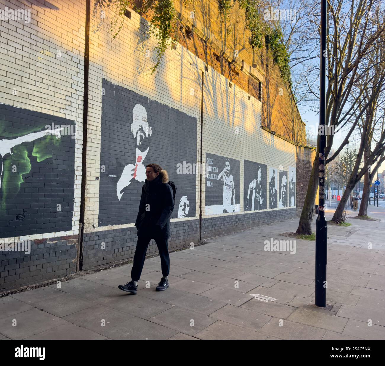 Graffiti by a street artist (Northbanksy on X) of Arsenal players on ...