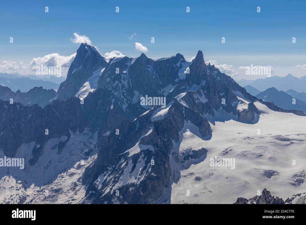 Snow mountain summits and white ice glacier in the Alps. Mont Blanc climbing route and views ...