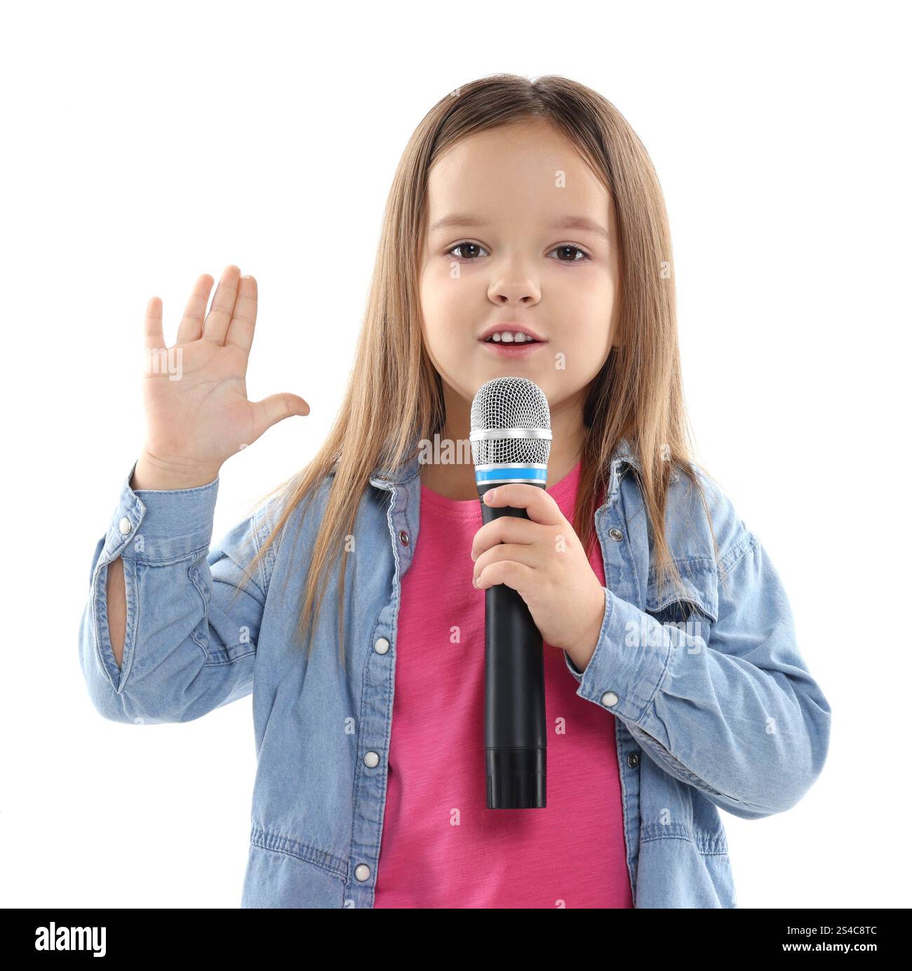 Cute girl with microphone singing on white background Stock Photo - Alamy