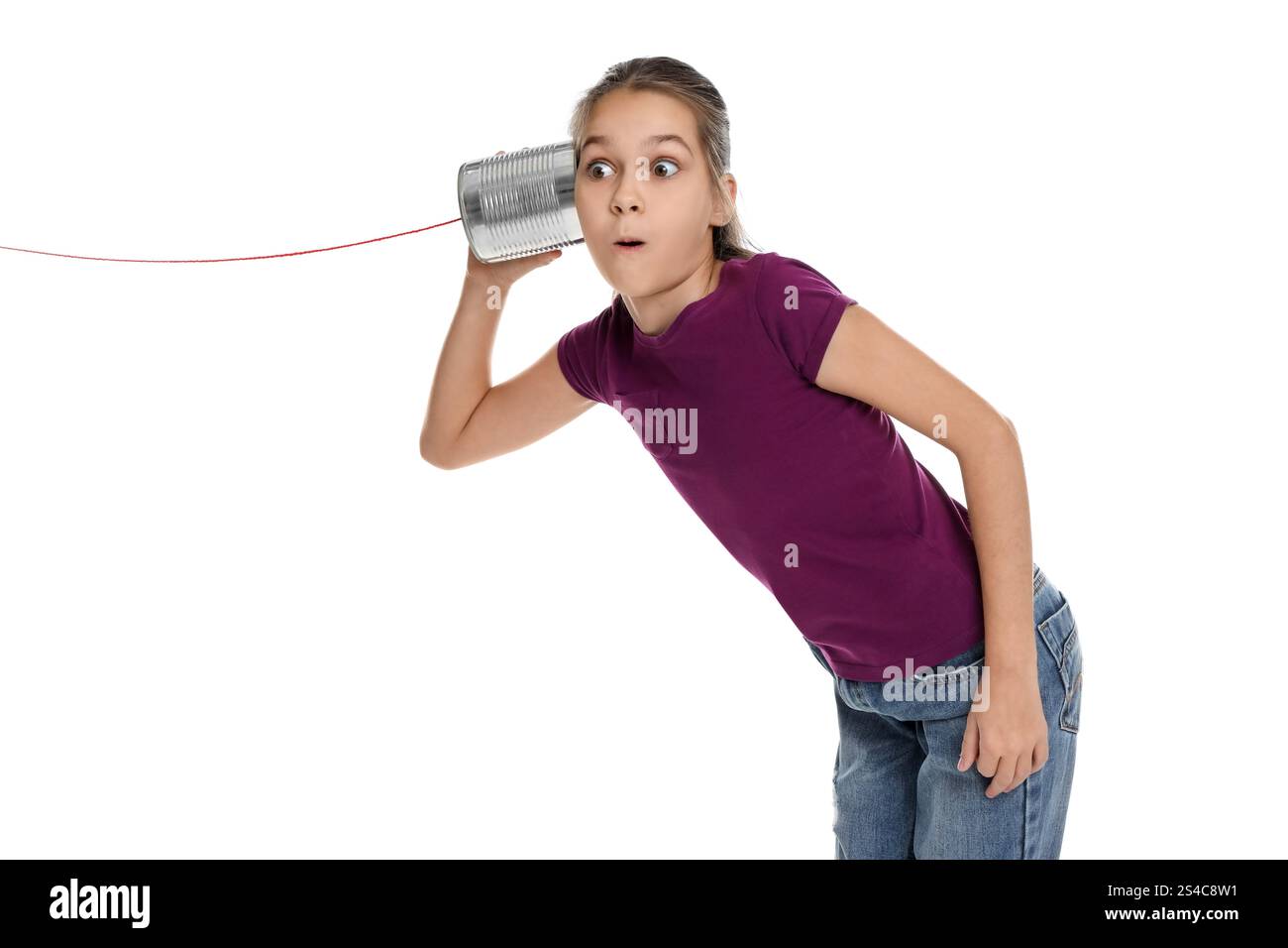 Girl using tin can telephone on white background Stock Photo - Alamy