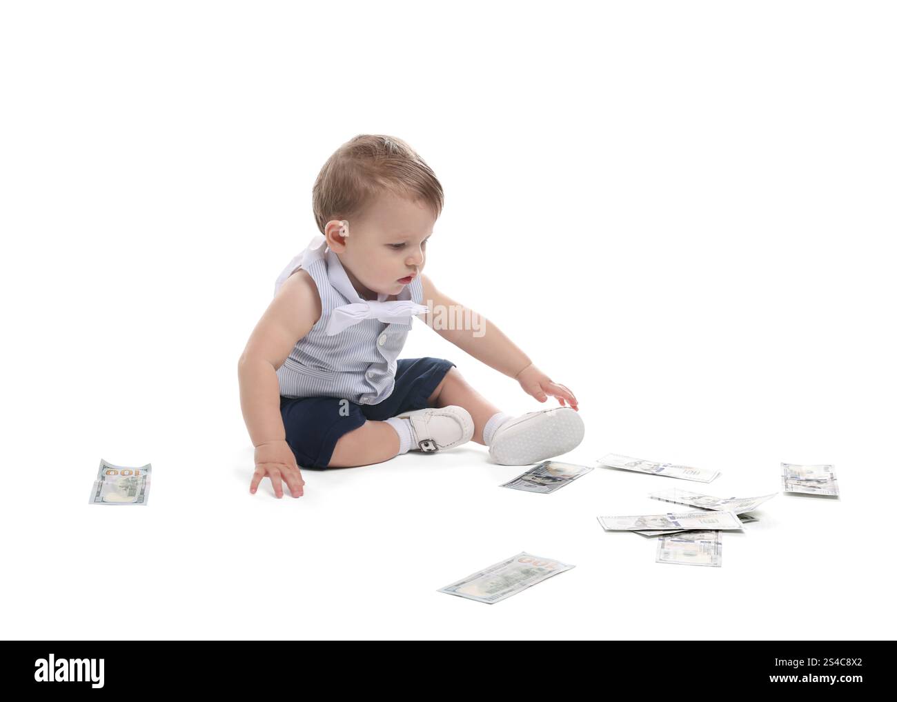 Little baby with money on white background Stock Photo - Alamy