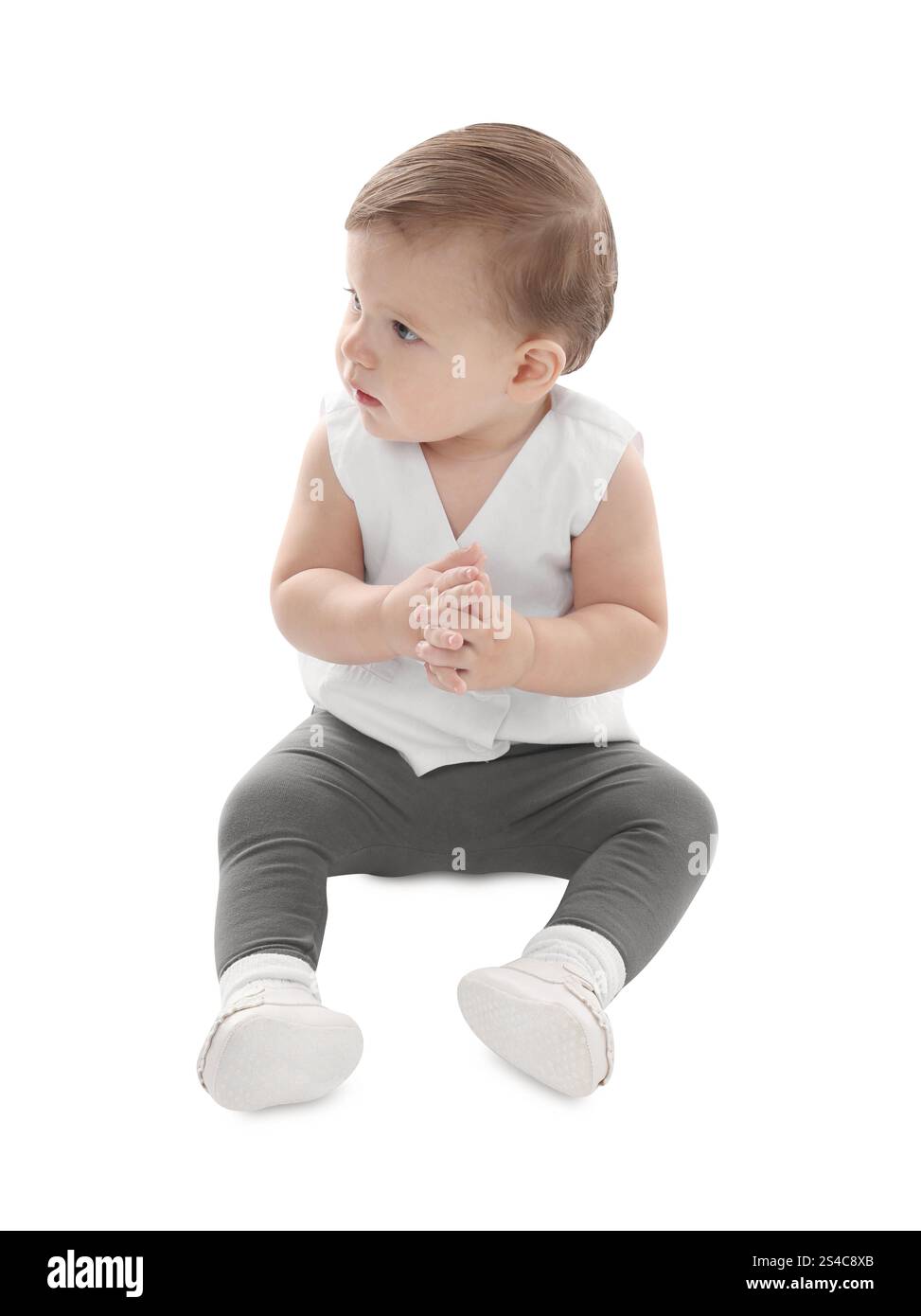 Cute little baby sitting on white background Stock Photo - Alamy