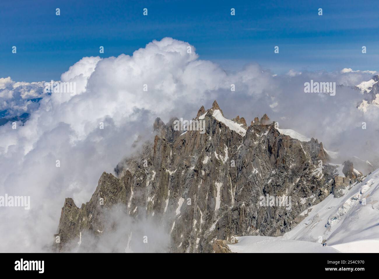 Snow mountain summits and white ice glacier in the Alps. Mont Blanc climbing route and views ...