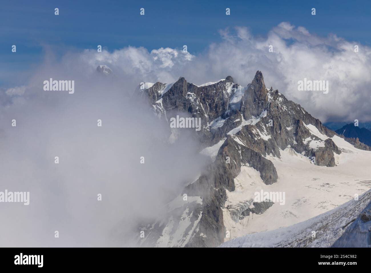 Snow mountain summits and white ice glacier in the Alps. Mont Blanc climbing route and views ...