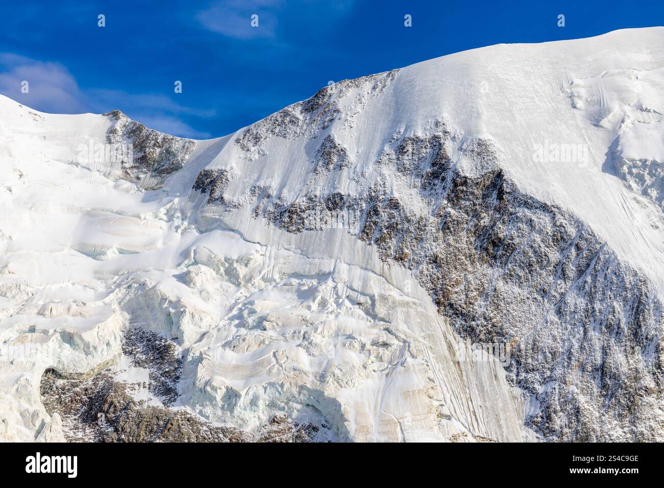 Snow mountain summits and white ice glacier in the Alps. Mont Blanc climbing route and views ...
