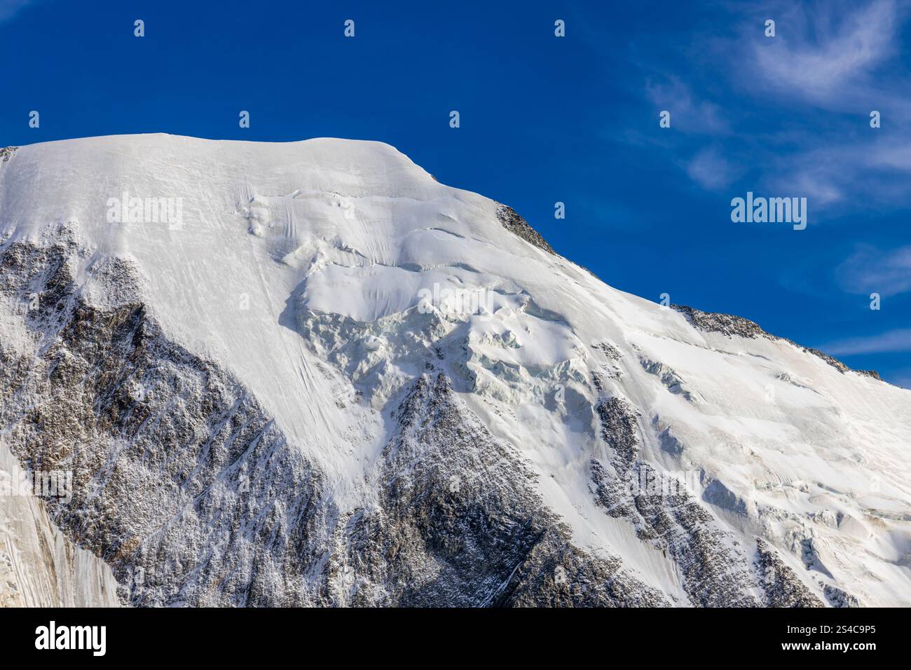 Snow mountain summits and white ice glacier in the Alps. Mont Blanc climbing route and views ...
