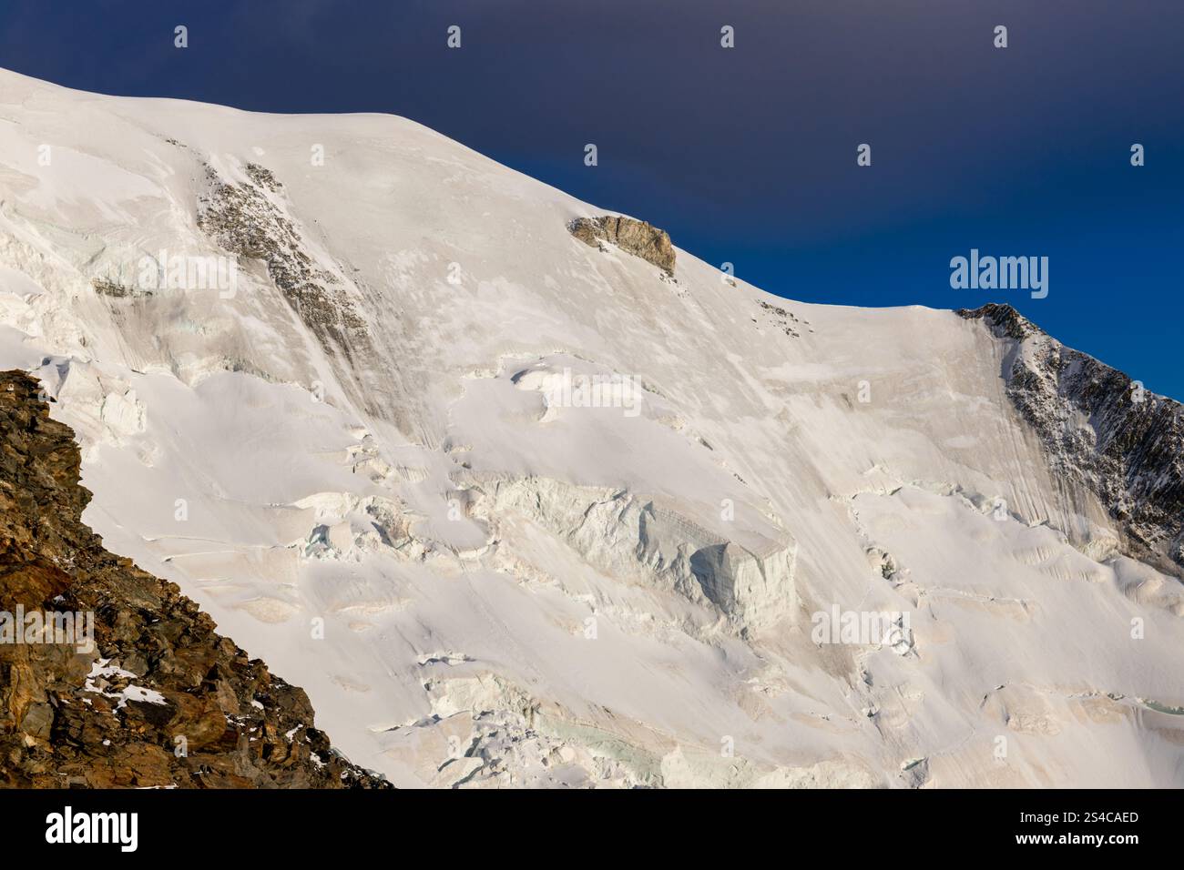 Snow mountain summits and white ice glacier in the Alps. Mont Blanc climbing route and views ...
