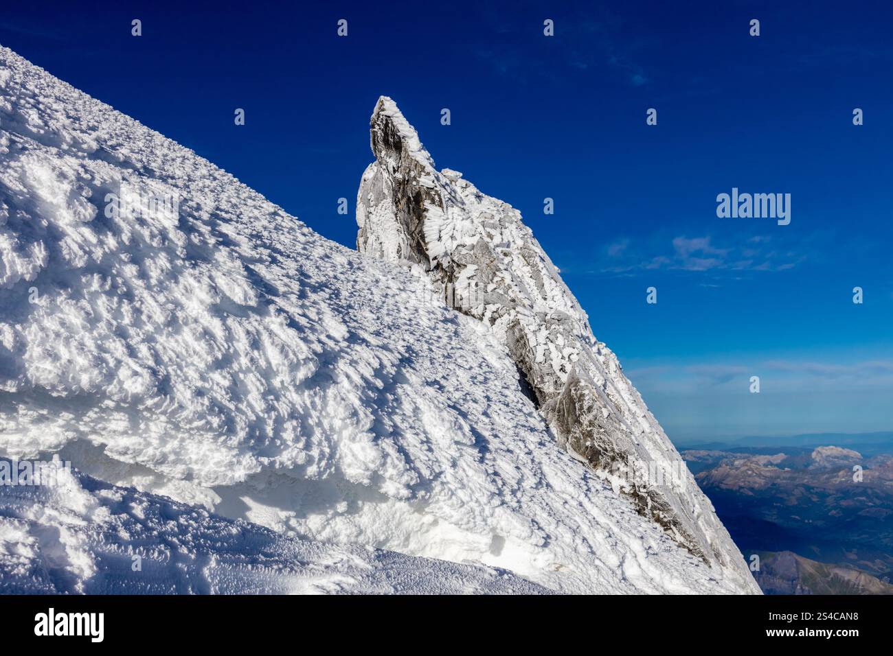 Snow mountain summits and white ice glacier in the Alps. Mont Blanc climbing route and views ...
