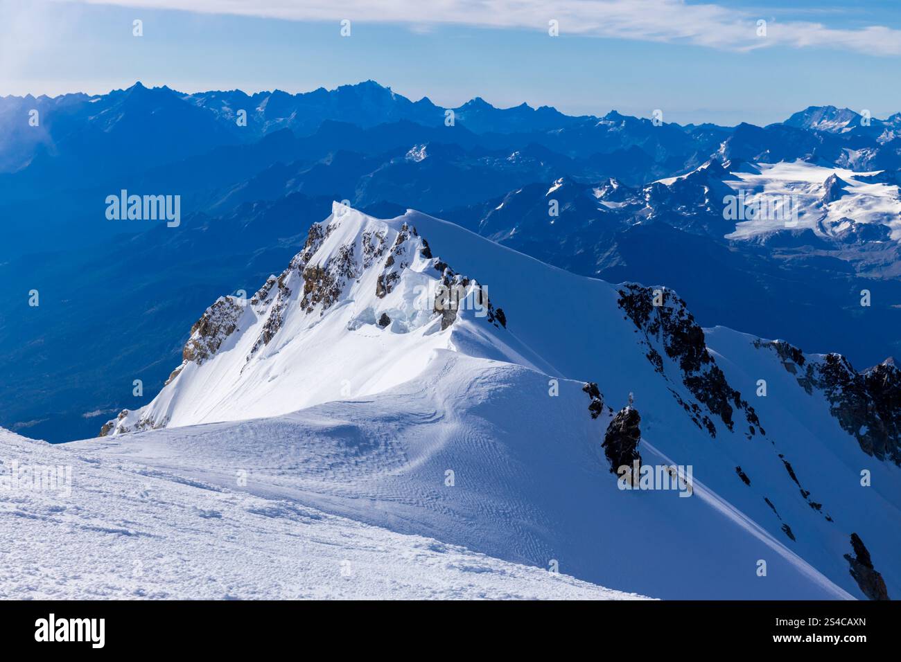 Snow mountain summits and white ice glacier in the Alps. Mont Blanc climbing route and views ...
