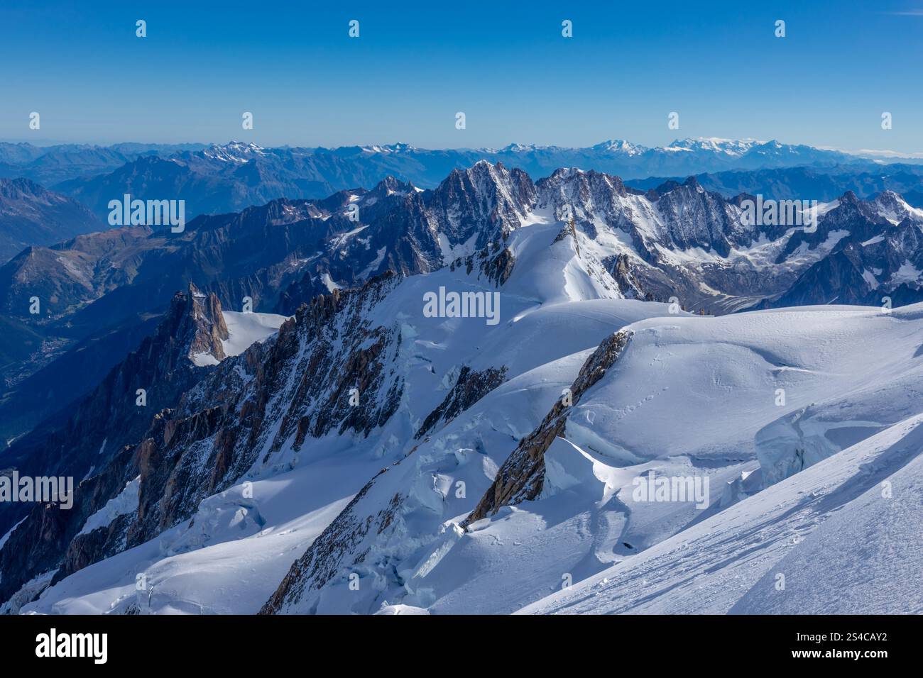 Snow mountain summits and white ice glacier in the Alps. Mont Blanc climbing route and views ...