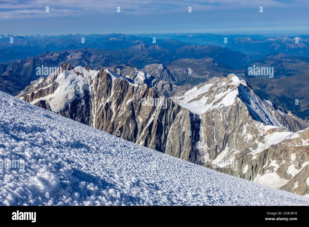 Snow mountain summits and white ice glacier in the Alps. Mont Blanc climbing route and views ...