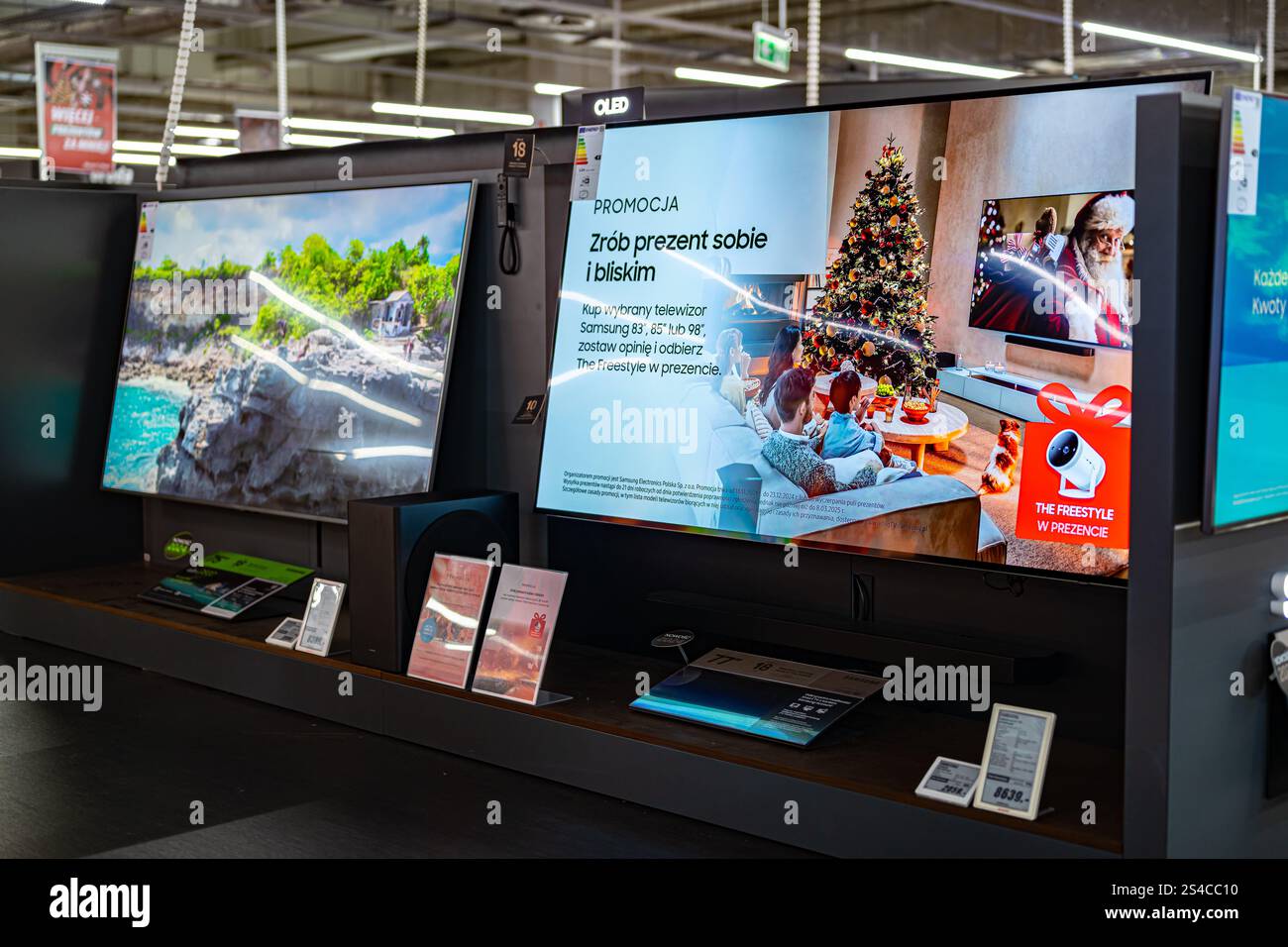 POZNAN, POL - DEC 5, 2024: Modern flat-screen TV sets put up for sale ...