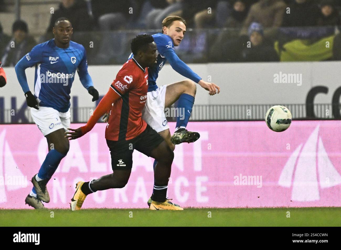 Genk, Belgium. 11th Jan, 2025. OHL's Ignace Konan N'Dri and Genk's ...