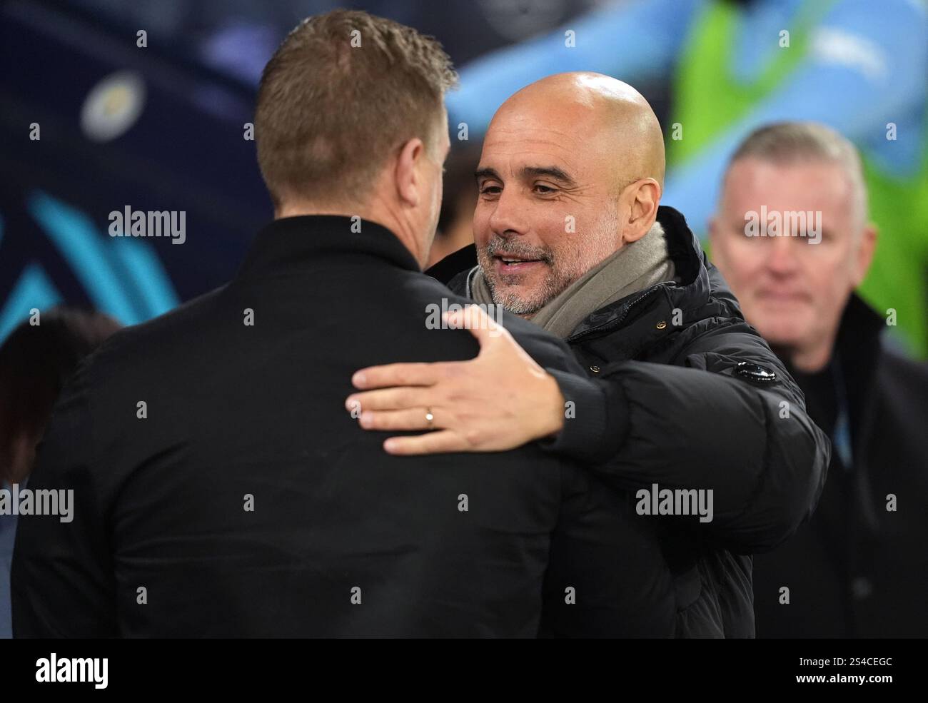 Manchester City manager Pep Guardiola with Salford City manager Karl ...