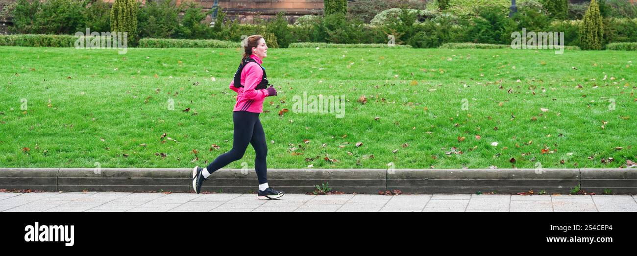 Woman running in the countryside for health and wellbeing Stock Photo ...