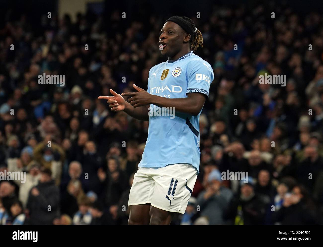Manchester City's Jeremy Doku celebrates scoring the opening goal ...