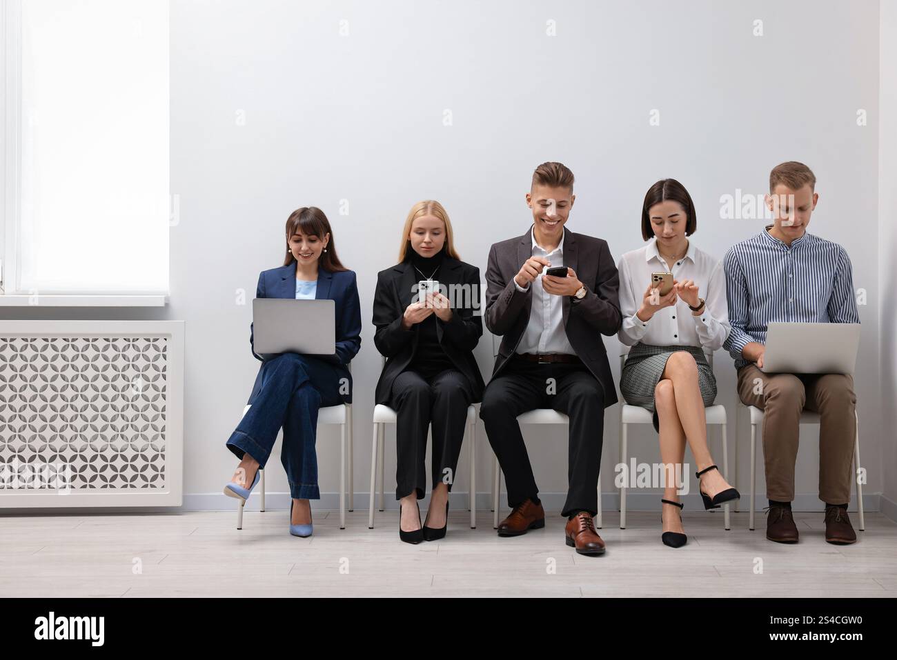 Group of people using different gadgets indoors. Modern technology ...