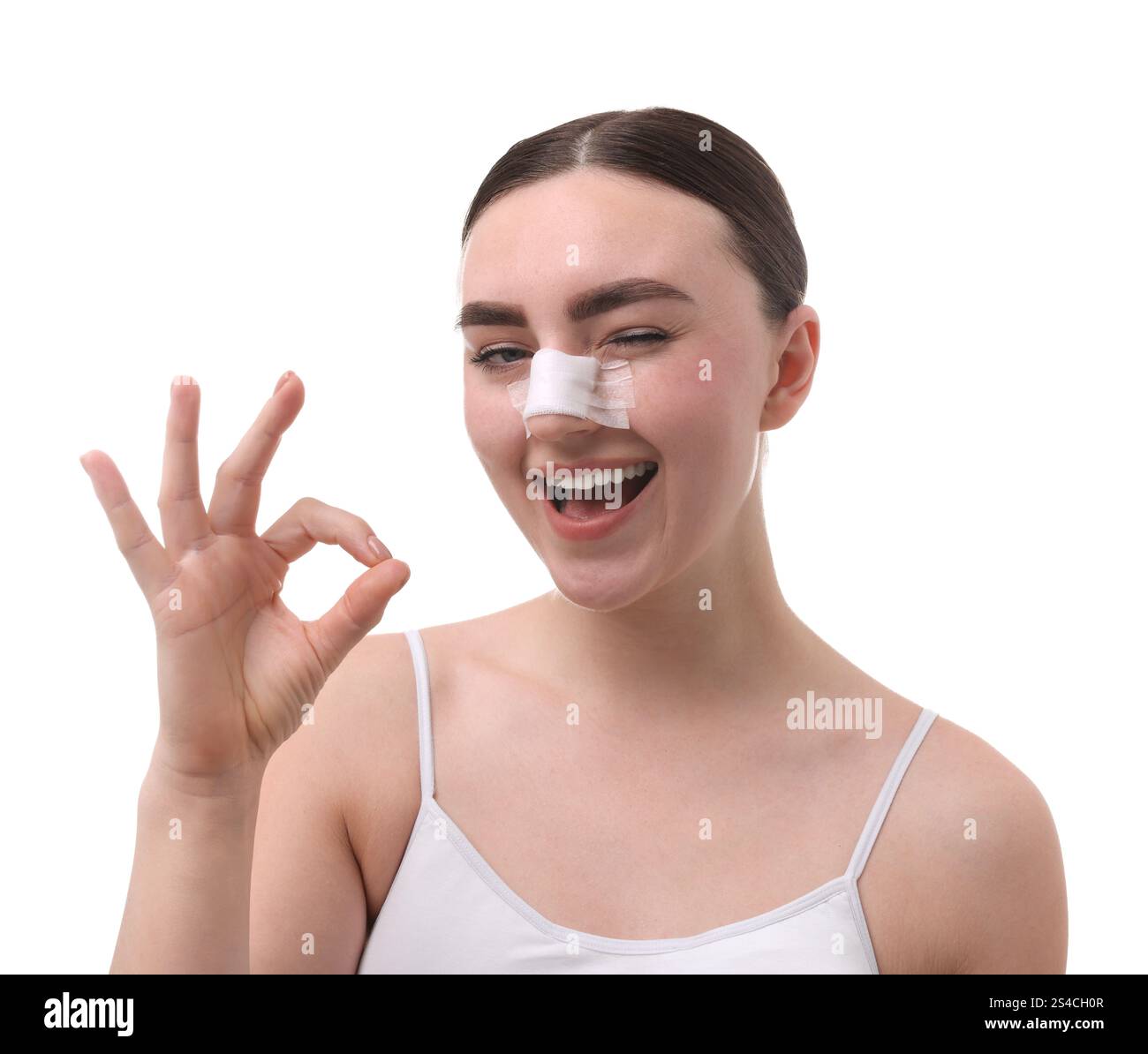 Woman with medical bandage on her nose after plastic surgery operation ...