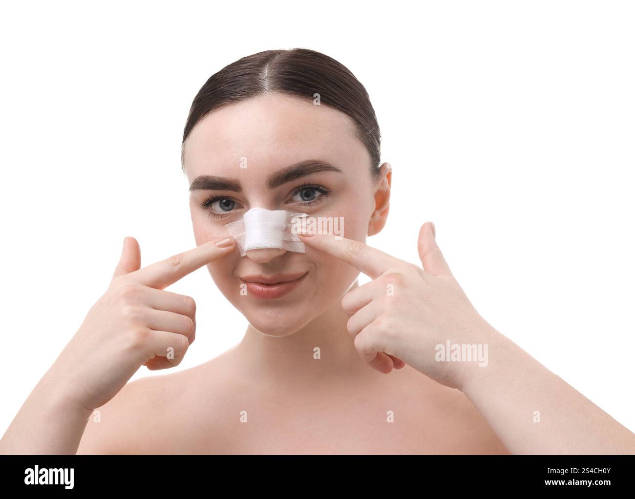 Woman with medical bandage on her nose after plastic surgery operation ...