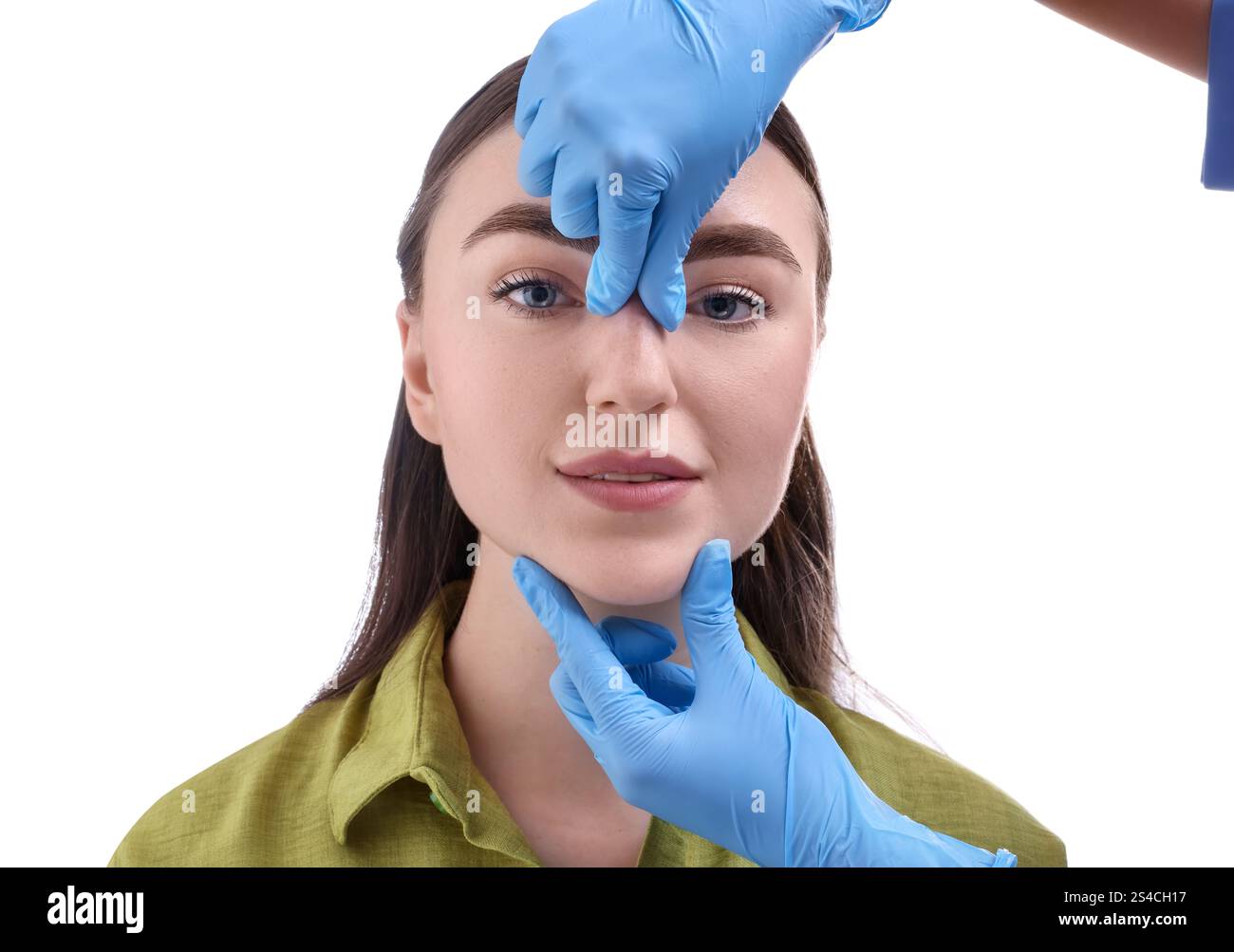 Doctor checking patient's nose before plastic surgery operation on ...