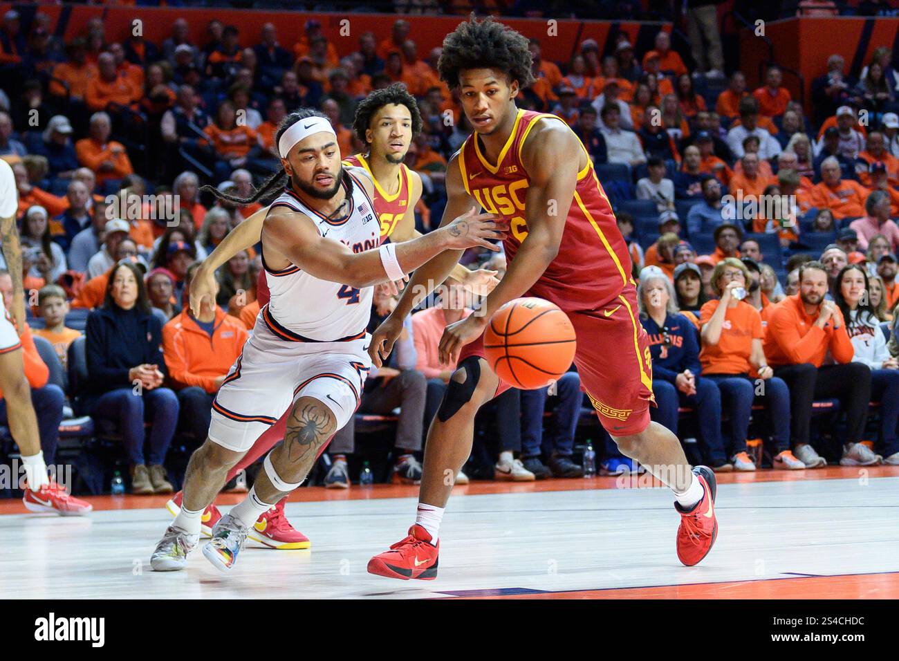 Illinois' Kylan Boswell competes for the loose ball against Southern ...