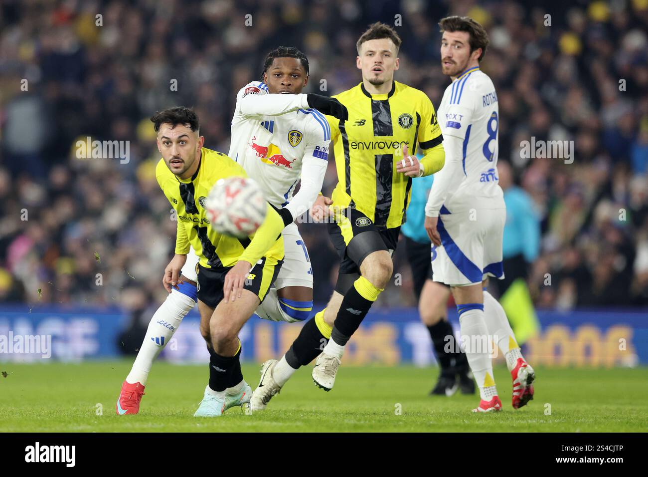 Leeds United's Largie Ramazani (centre left) and Harrogate Town's Levi ...