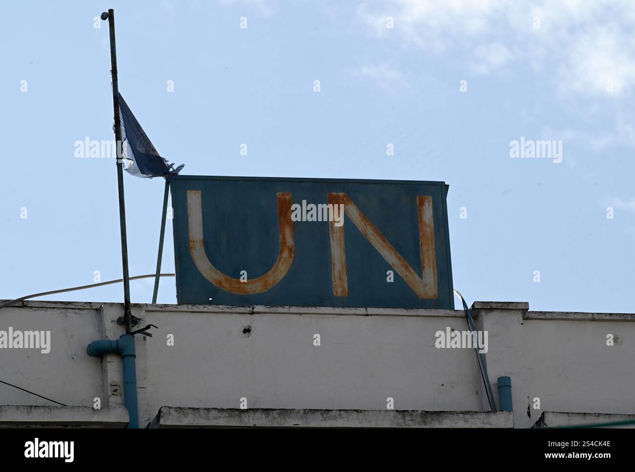 A tattered United Nations flag flies outside the UNRWA, United Nations ...