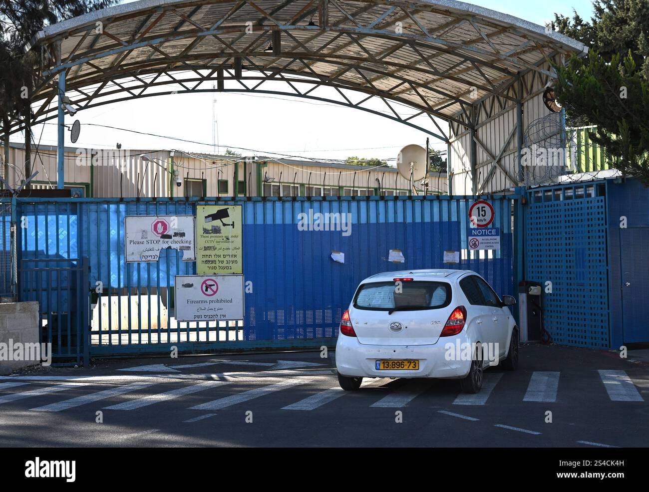 A car waits to enter the UNRWA West Bank Field office in East Jerusalem ...