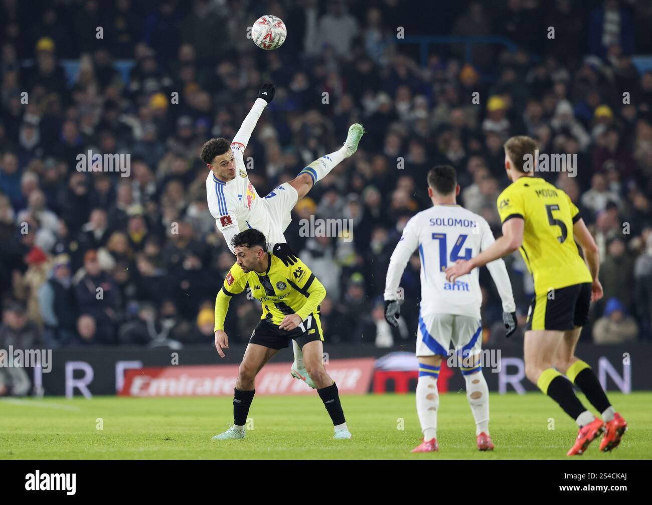 Leeds United's Ethan Ampadu (top) and Harrogate Town's Levi Sutton ...