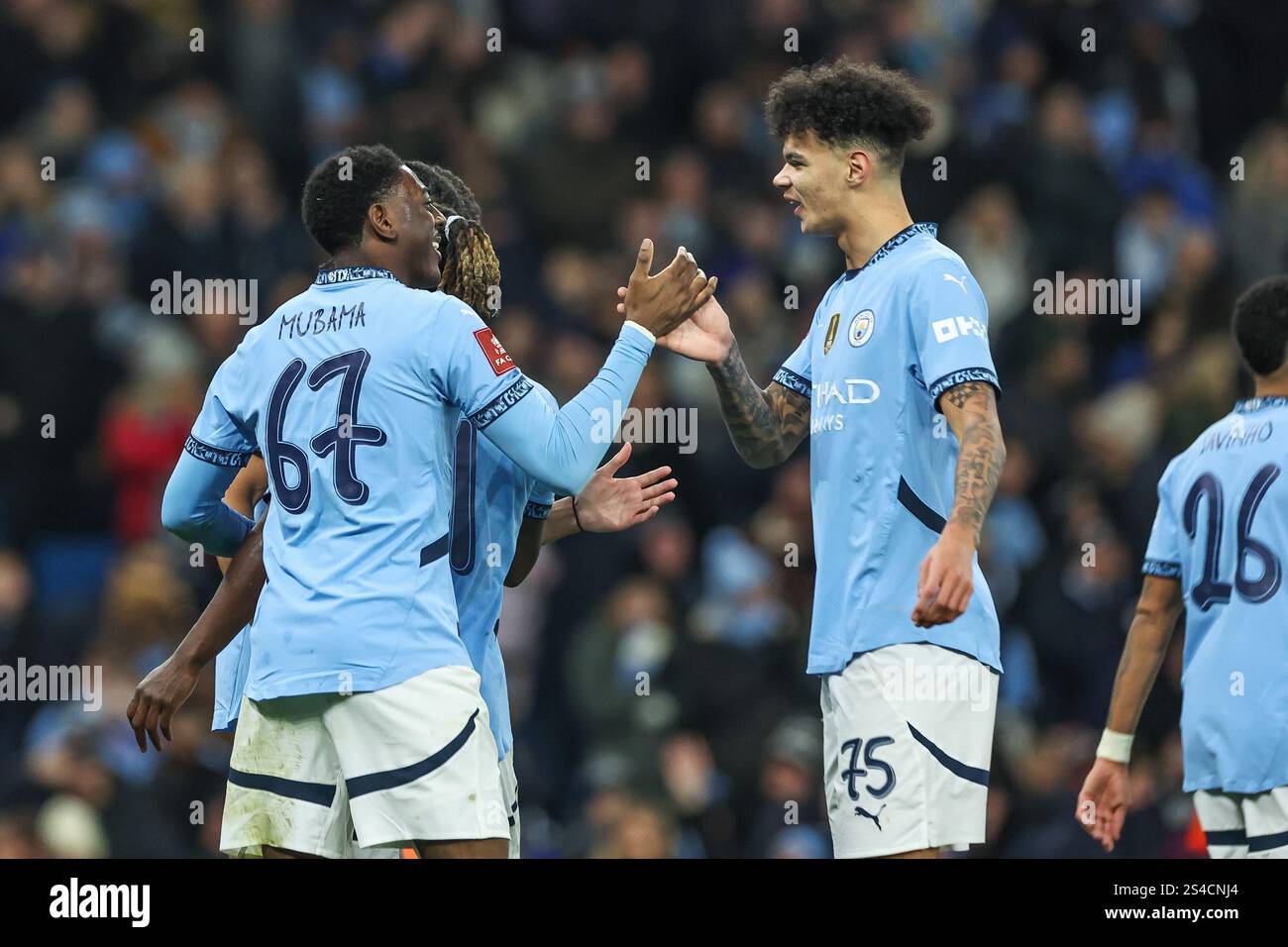 Divin Mubama of Manchester City celebrates his goal to make it 2-0 ...