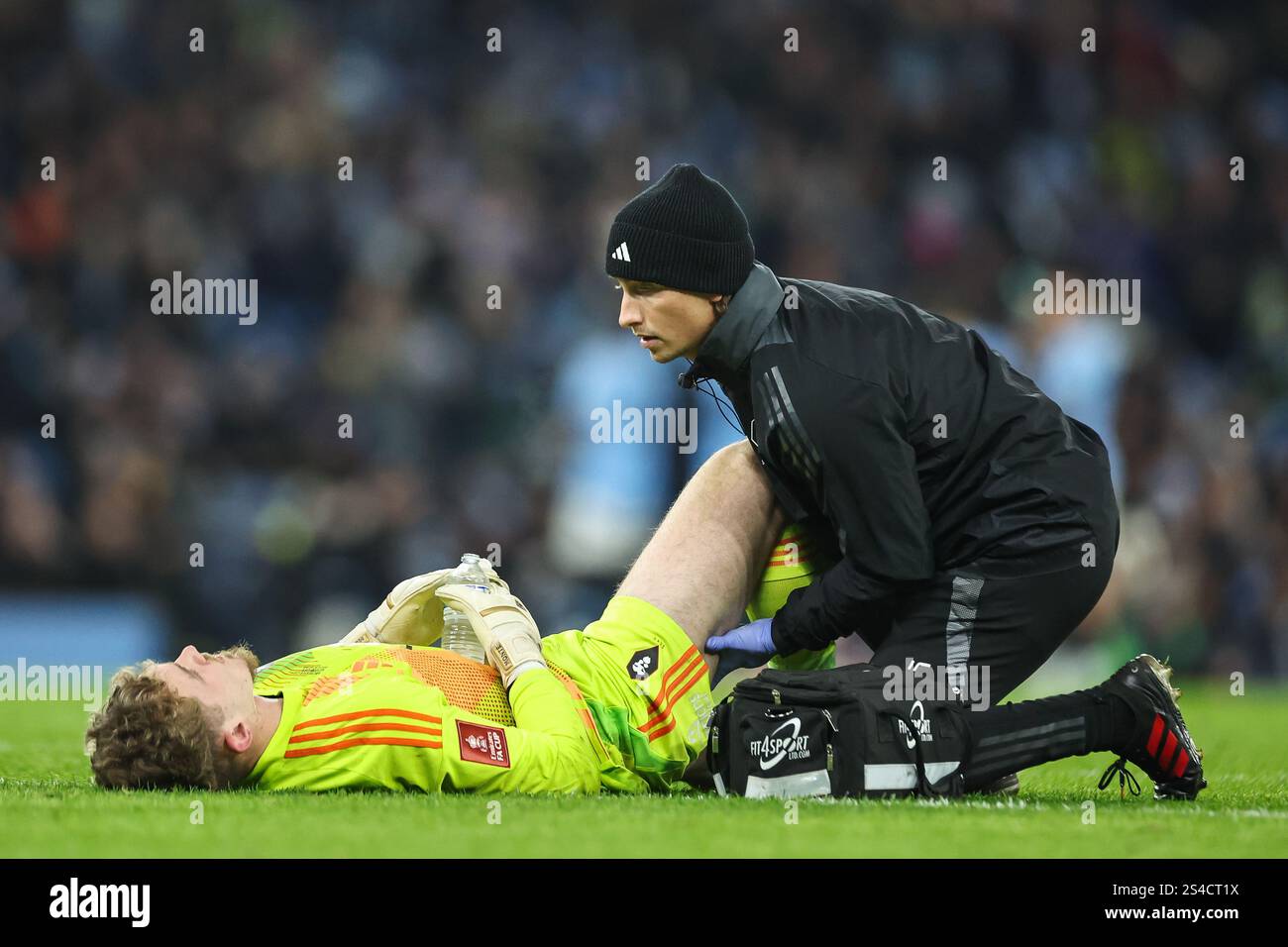 Matthew Young of Salford City receives treatment during the Emirates FA ...
