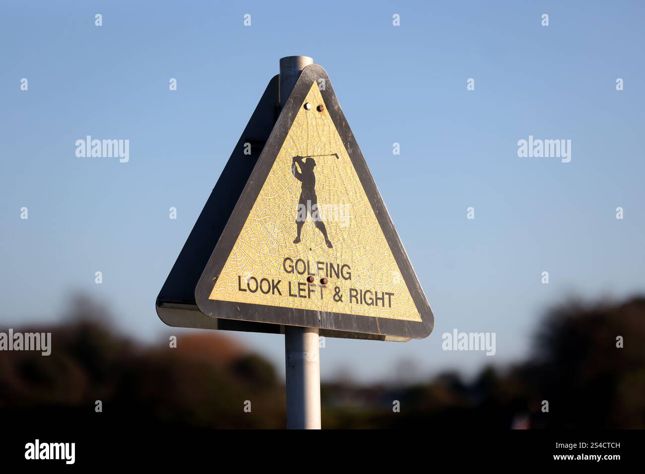 A Golfing sign advising to look left and right and be aware of golf ...
