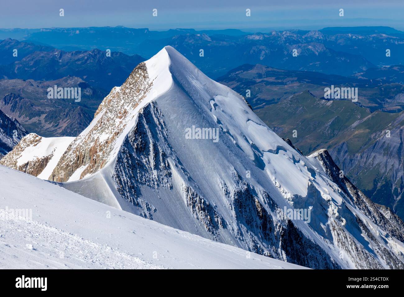 Snow mountain summits and white ice glacier in the Alps. Mont Blanc climbing route and views ...