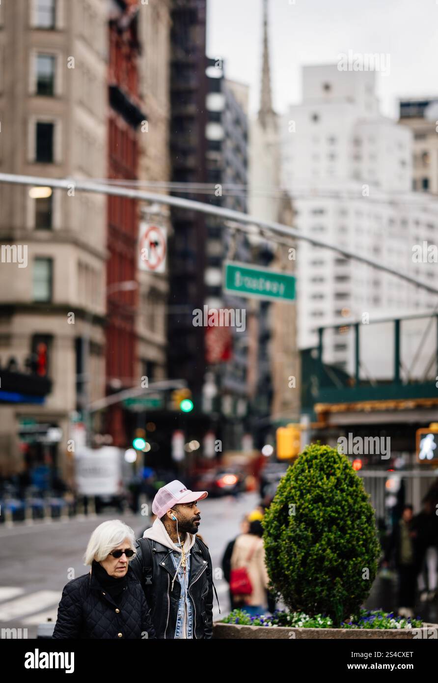 Two People Walking Side by Side on a City Street Stock Photo - Alamy