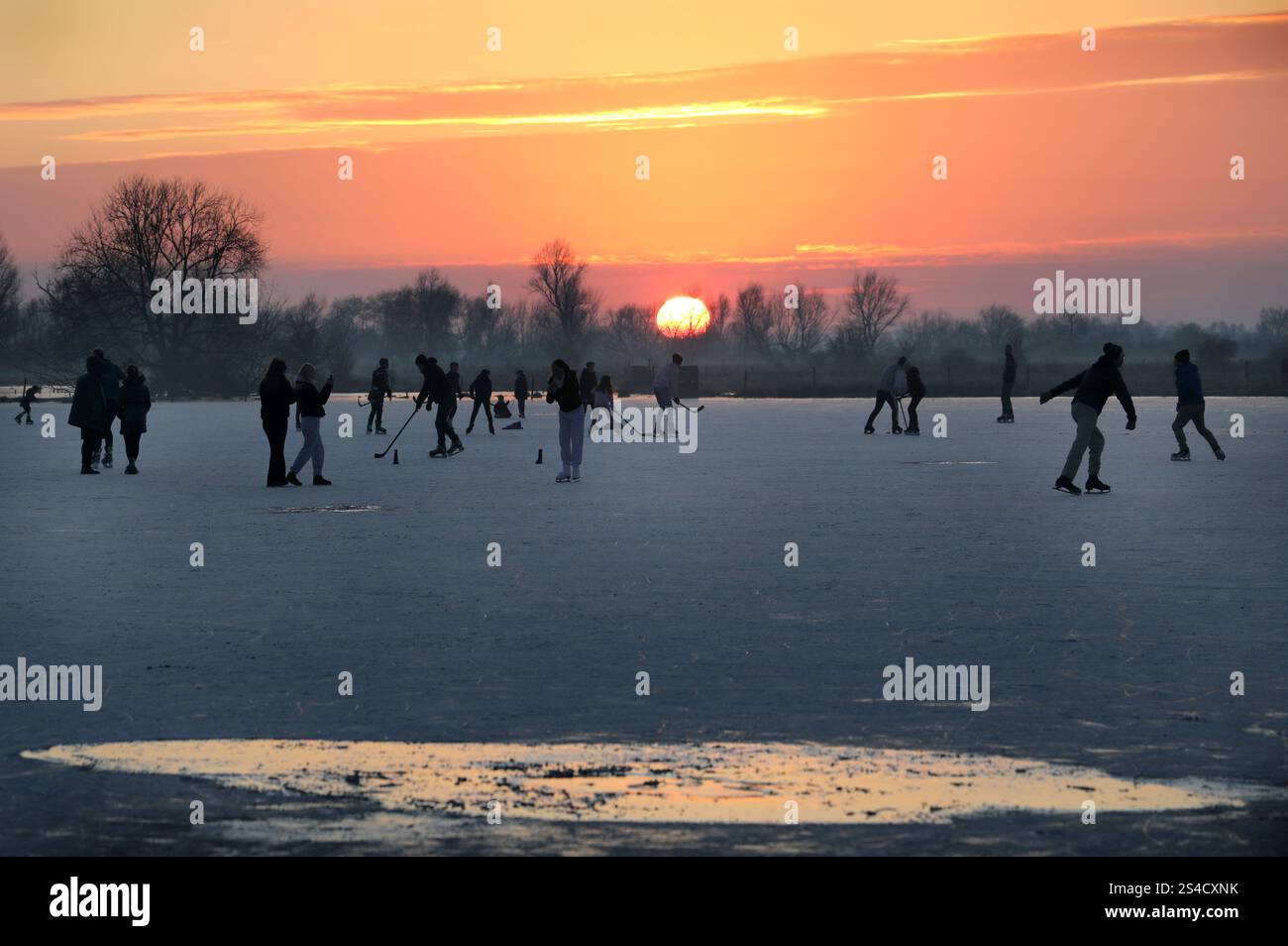 Upware, England, UK. 11th Jan, 2025. Skaters enjoy the natural ice at ...