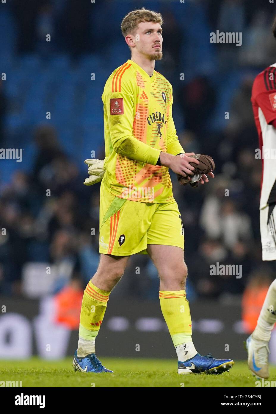 Manchester, UK. 11th Jan, 2025. Matthew Young of Salford City walks to ...