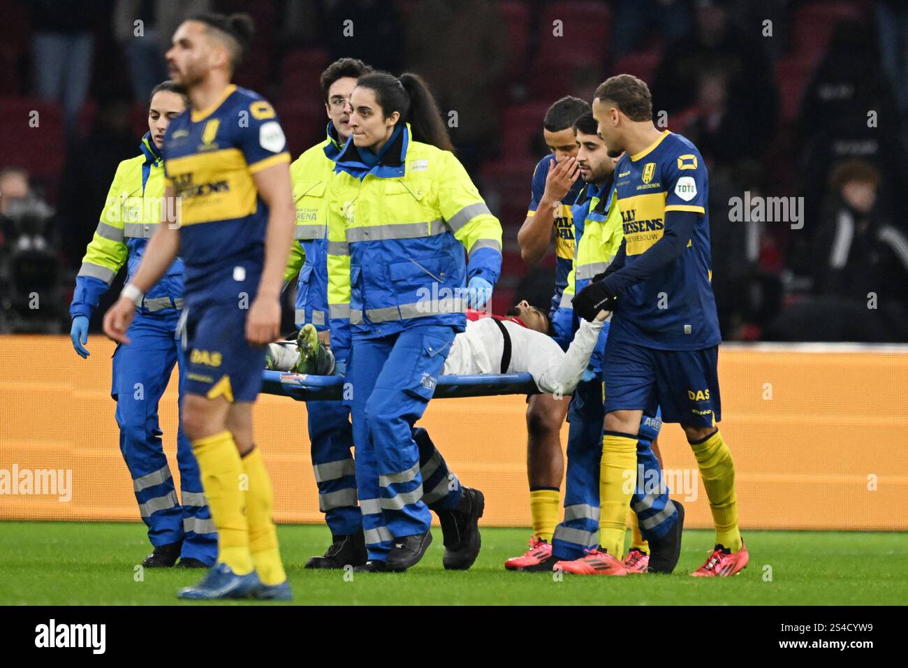 AMSTERDAM - Owen Wijndal of Ajax is carried off the pitch by stretcher ...