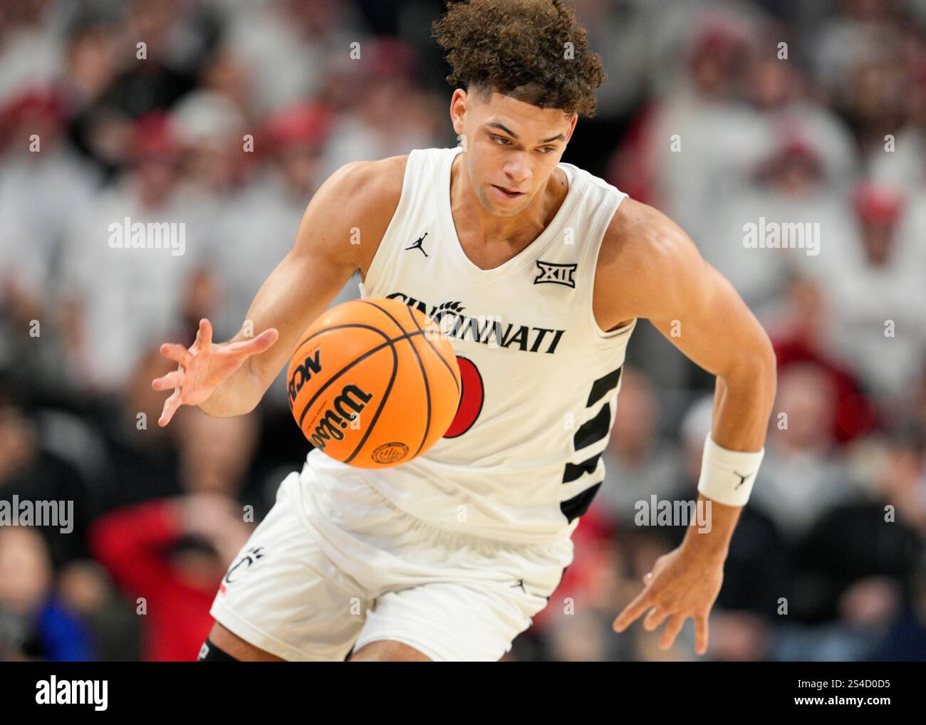 Cincinnati guard Dan Skillings Jr. dribbles after a steal during the ...