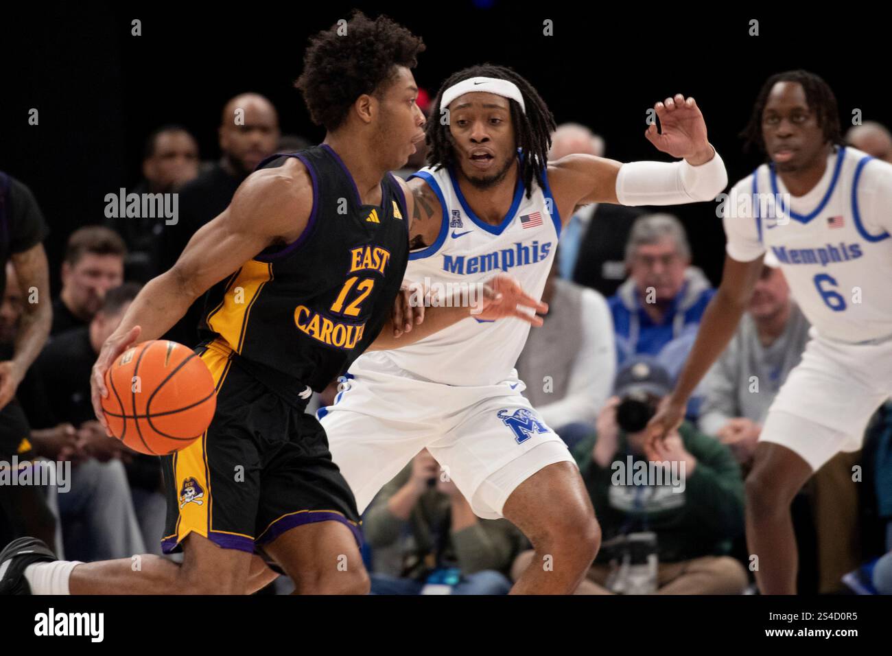 East Carolina guard Jordan Riley (12) dribbles the ball defended by ...